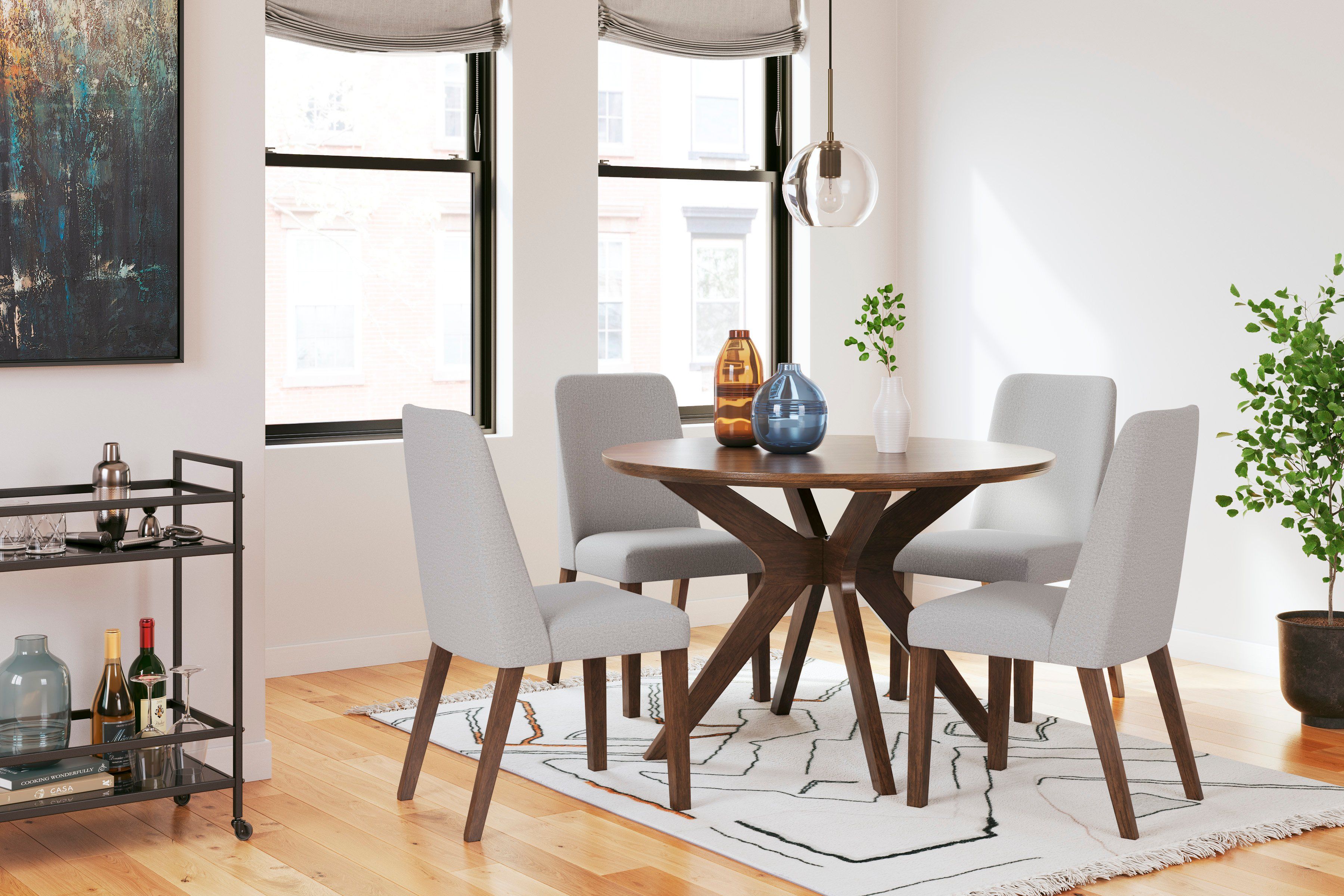 Lyncott Round Dining Table | The Furniture Mart